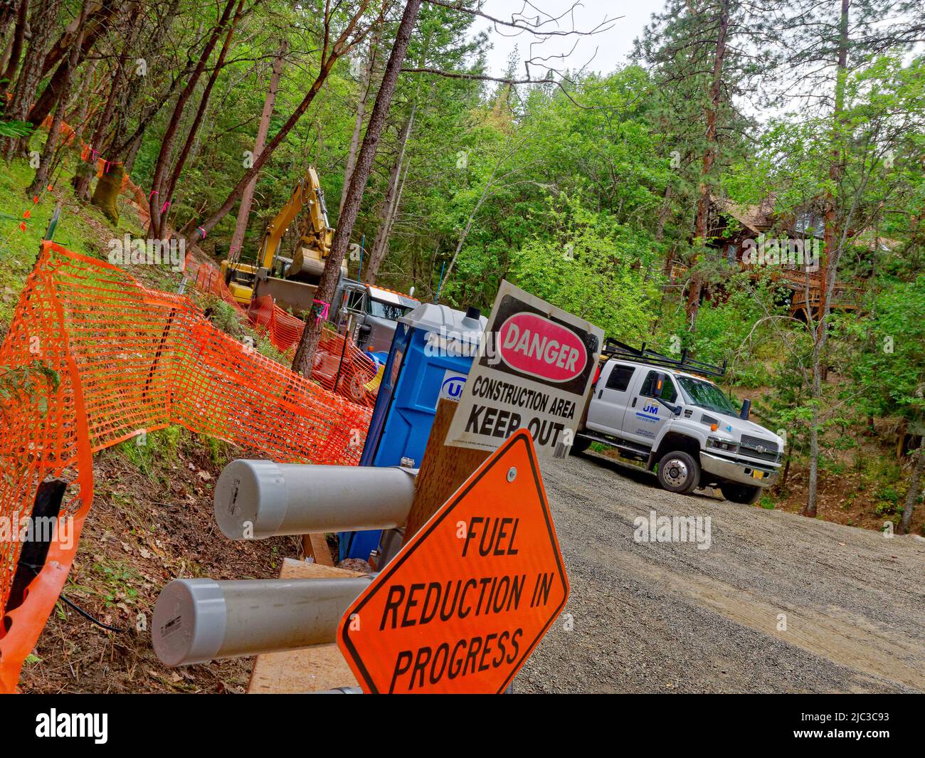 On the hillside above Ashland, Oregon, USA,a sign reads "fuel reduction ...