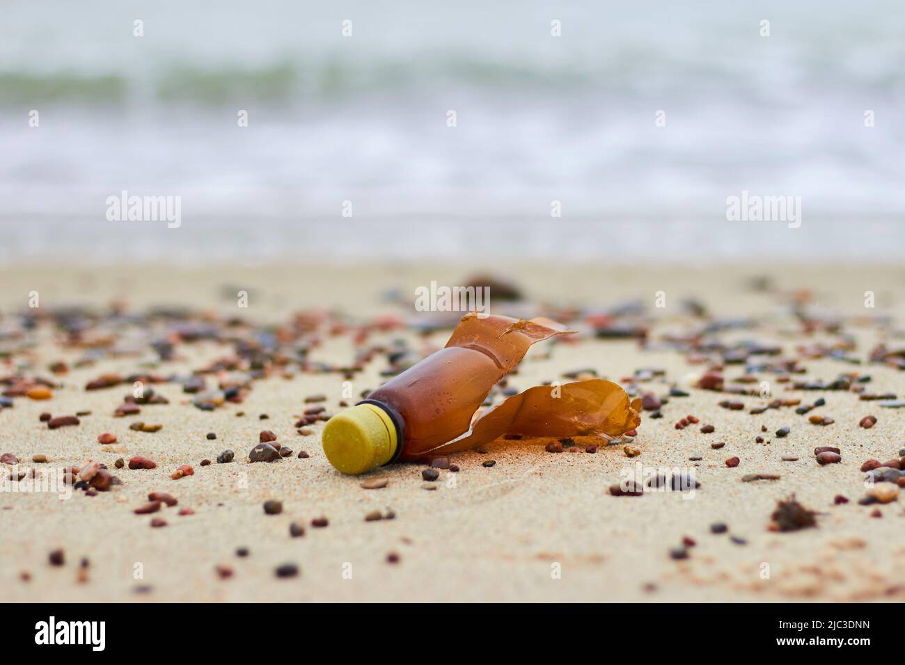 Plastic bottle on the seashore. Plastic clogging problem Stock Photo ...