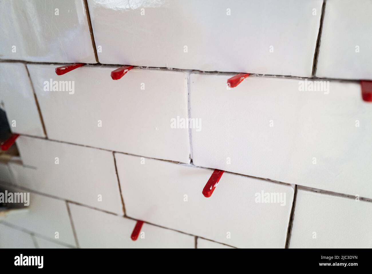 Ceramic tiles with pegs before grouting during installation Stock Photo ...