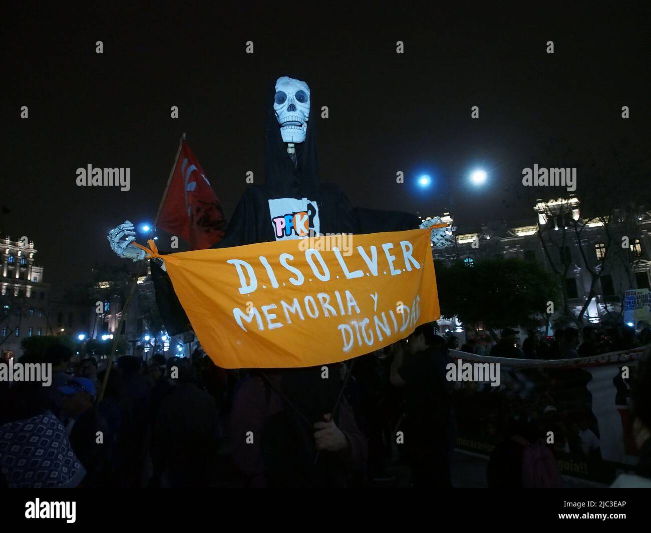 Skeleton with "To dissolve memory and dignity" banner. Hundreds of ...