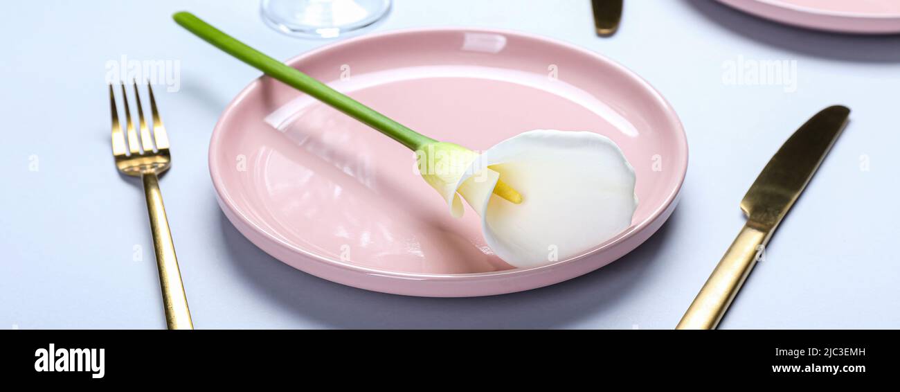 Beautiful table setting with calla lily on light background, closeup ...