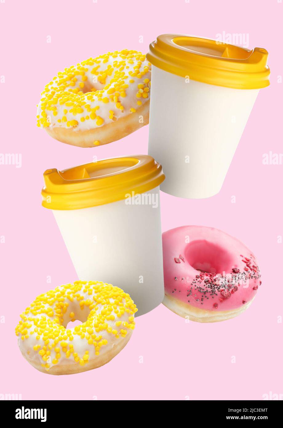 Flying cups of coffee and doughnuts on pink background Stock Photo - Alamy