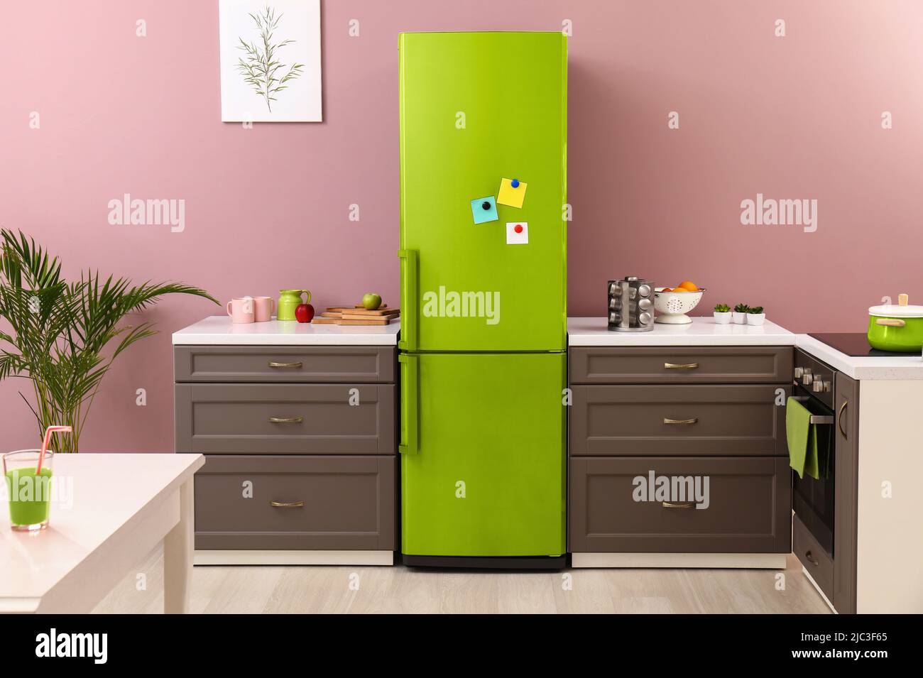 Interior of modern kitchen with green refrigerator Stock Photo - Alamy