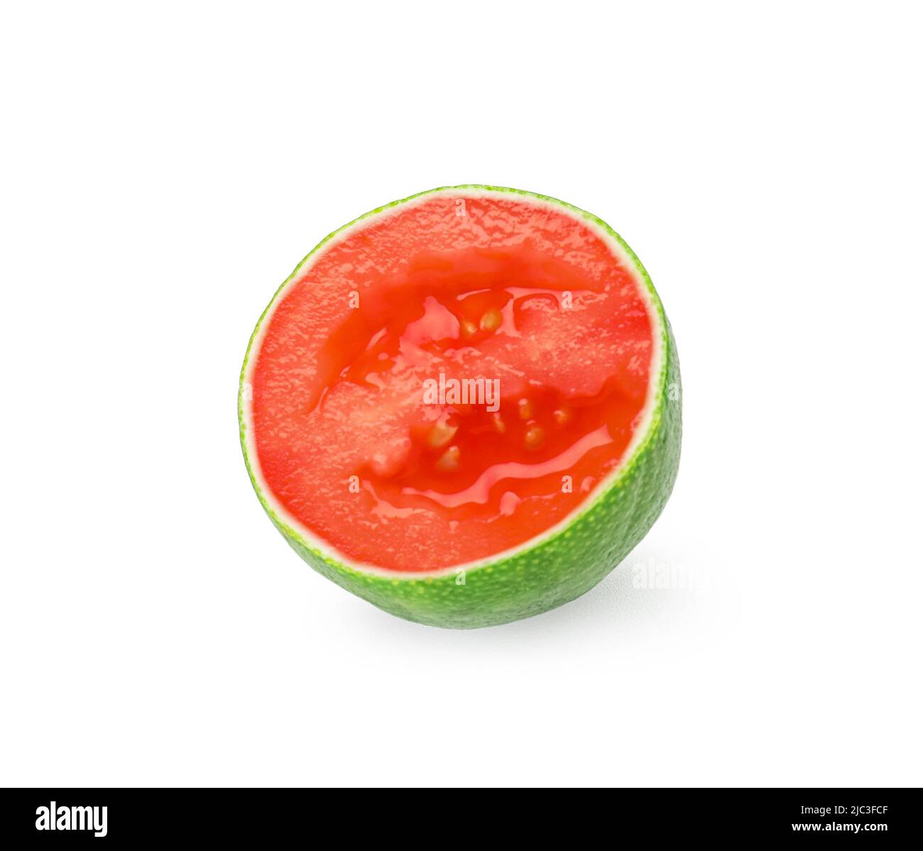 Cut lime with tomato inside on white background. Concept of photo ...