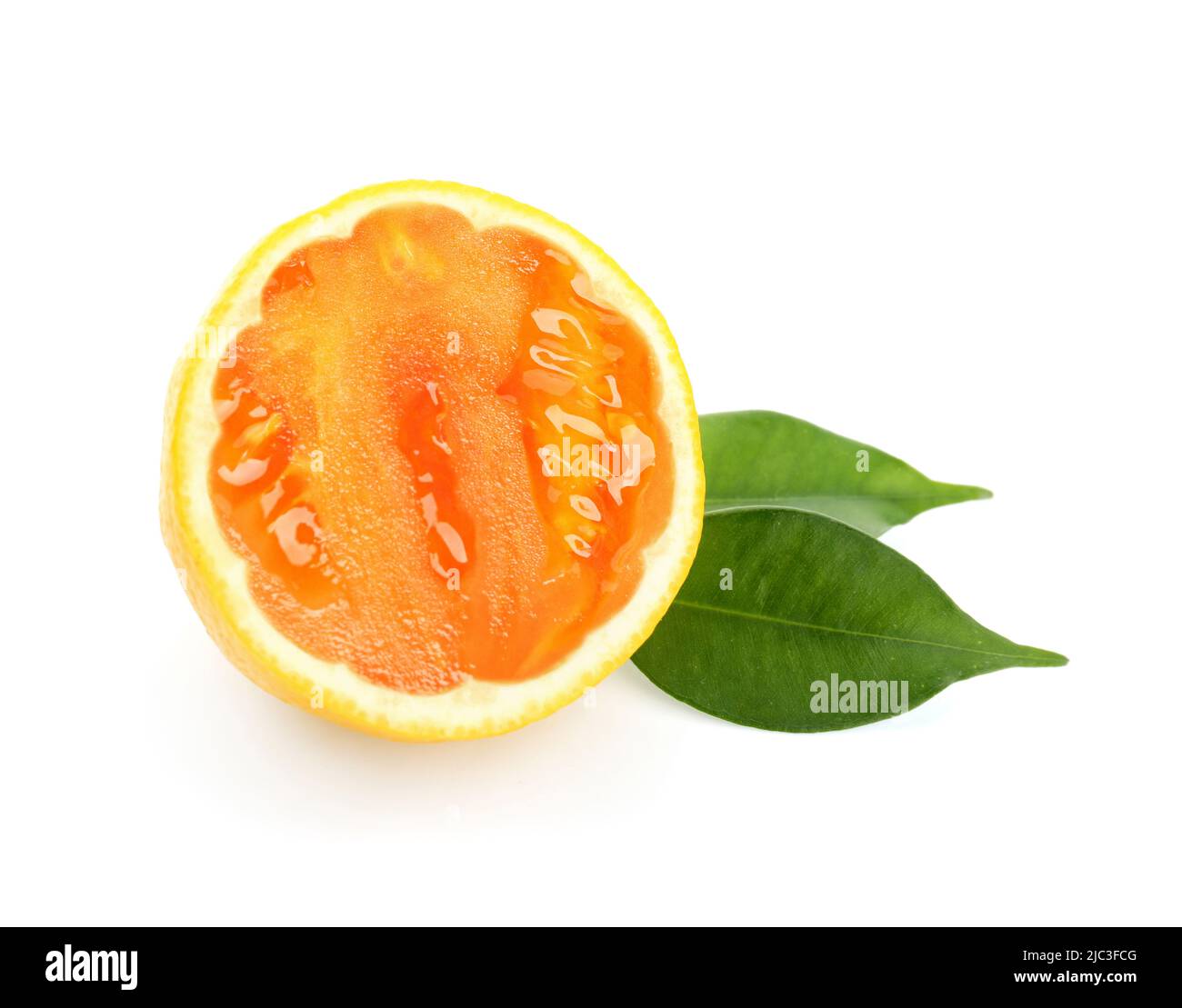 Cut lemon with tomato inside isolated on white. Concept of photo ...