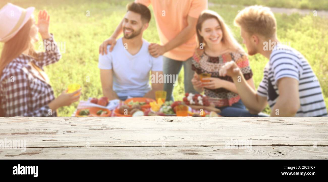 Empty wooden table at barbecue party outdoors Stock Photo - Alamy