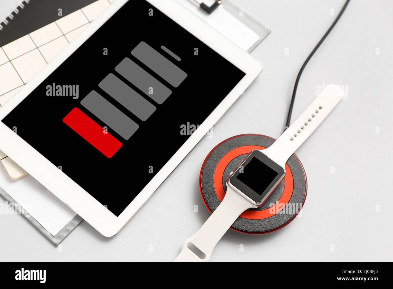 Smartwatch charging battery hi-res stock photography and images - Alamy