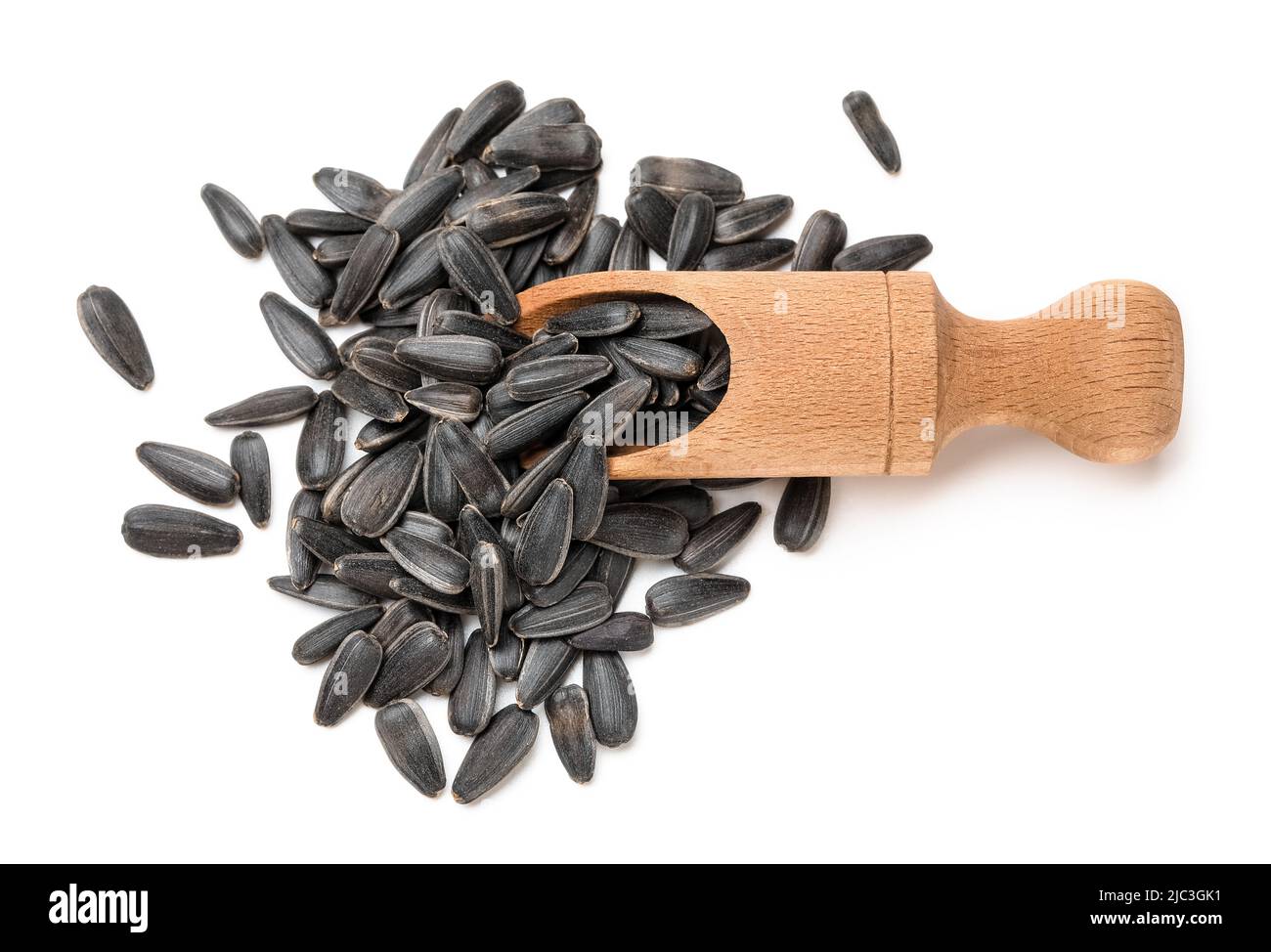 Wooden scoop and unpeeled sunflower seeds on white background Stock ...
