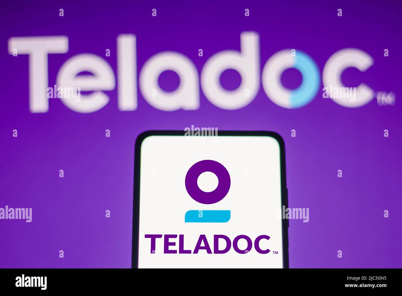 In this photo illustration, the Teladoc Health logo is displayed on a ...