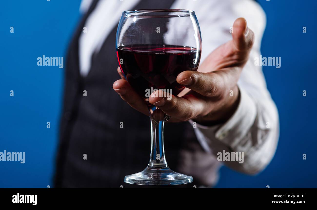 Man hand with glass of red wine. Tasting alcohol. Wine tour. Male ...