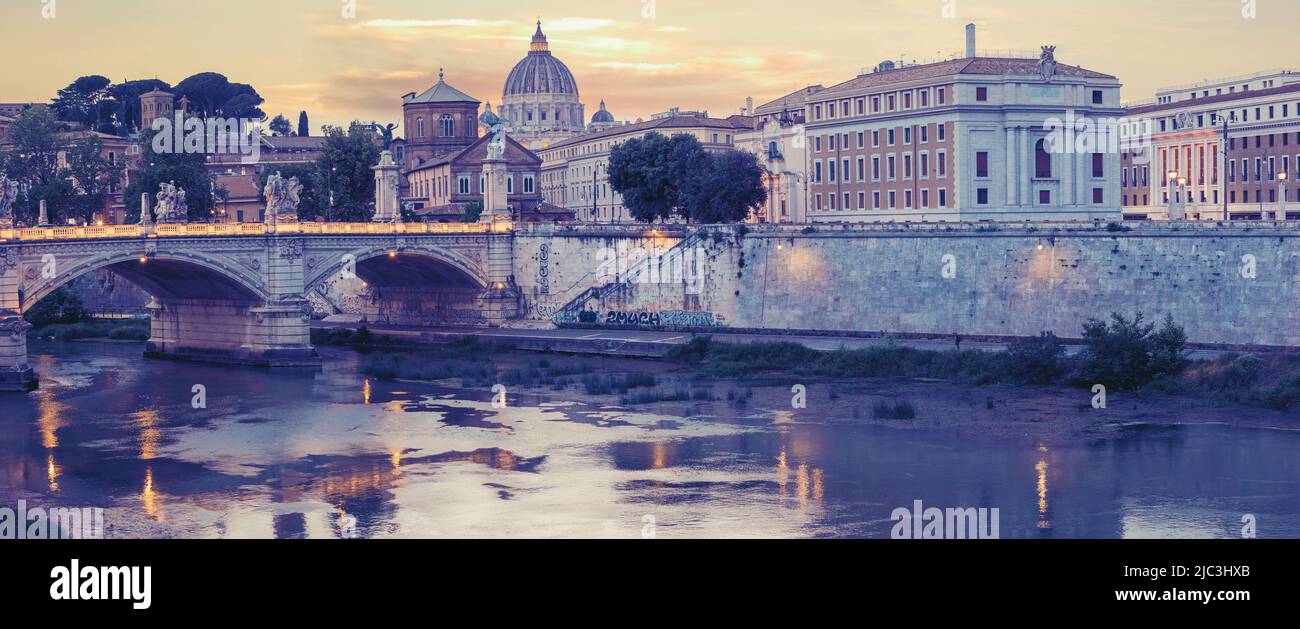 Saint Peter dome with with reflection on the Tiber river at sunset ...