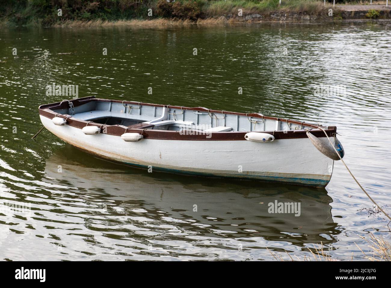 Old white wooden rowing boat Stock Photo - Alamy