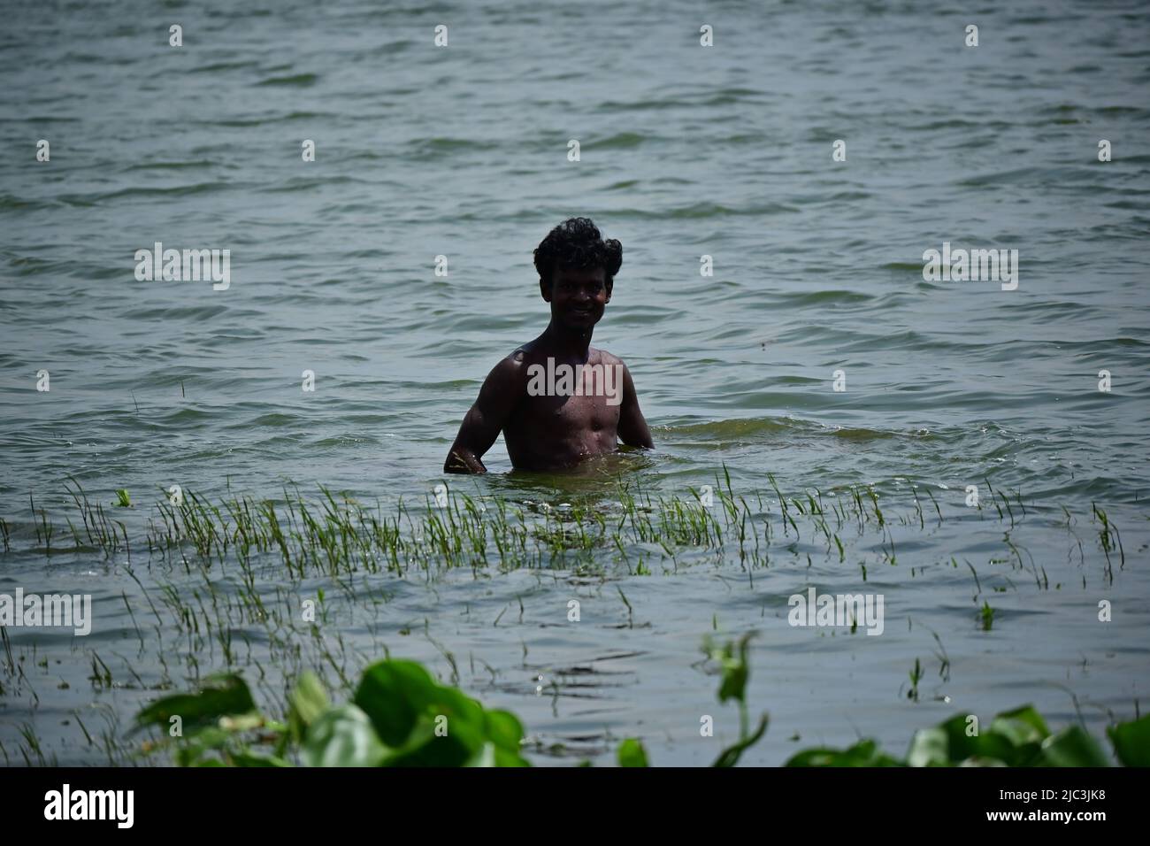 A boy in the river Stock Photo - Alamy