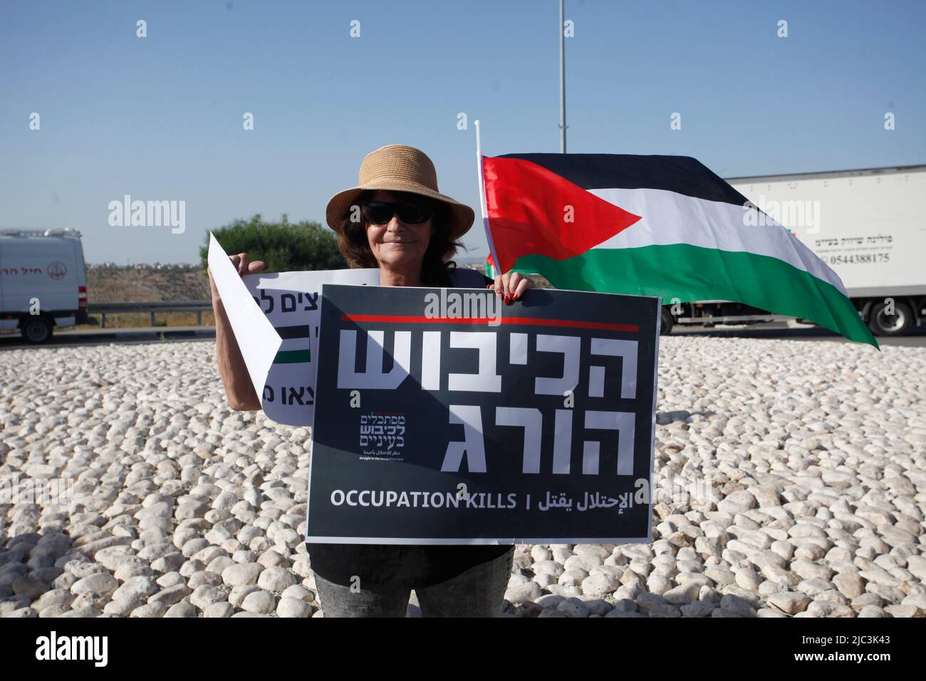 Qalqilya, Palestine. 09th June, 2022. A Palestinian holds a flag and ...