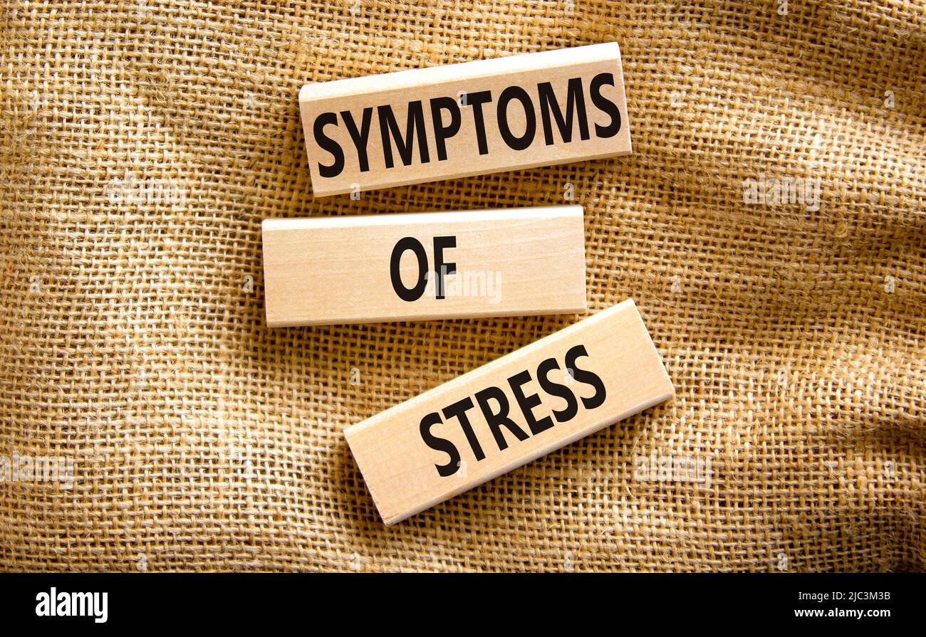 Symptoms of stress symbol. Concept words Symptoms of stress on wooden ...