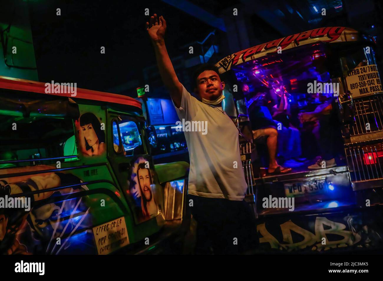 Quezon, Philippines. 09th June, 2022. Jeepney dispatcher shouts the ...