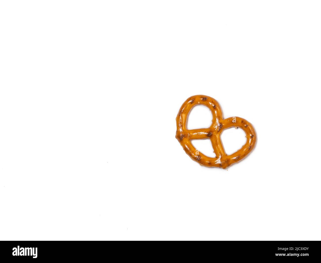 Small pretzel on a white background. Flour product. Baking for tea ...