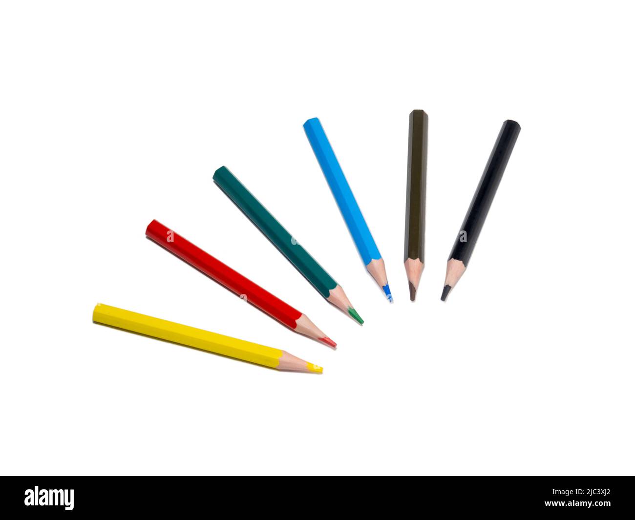 colored short pencils. Wooden pencils are laid out on a white ...