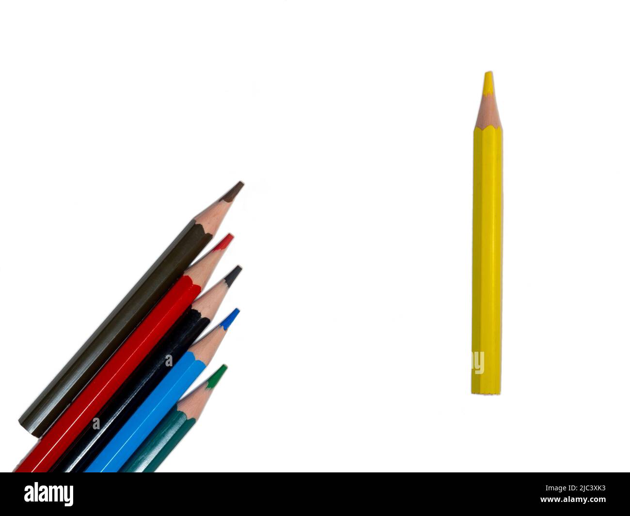 colored short pencils. Wooden pencils are laid out on a white ...