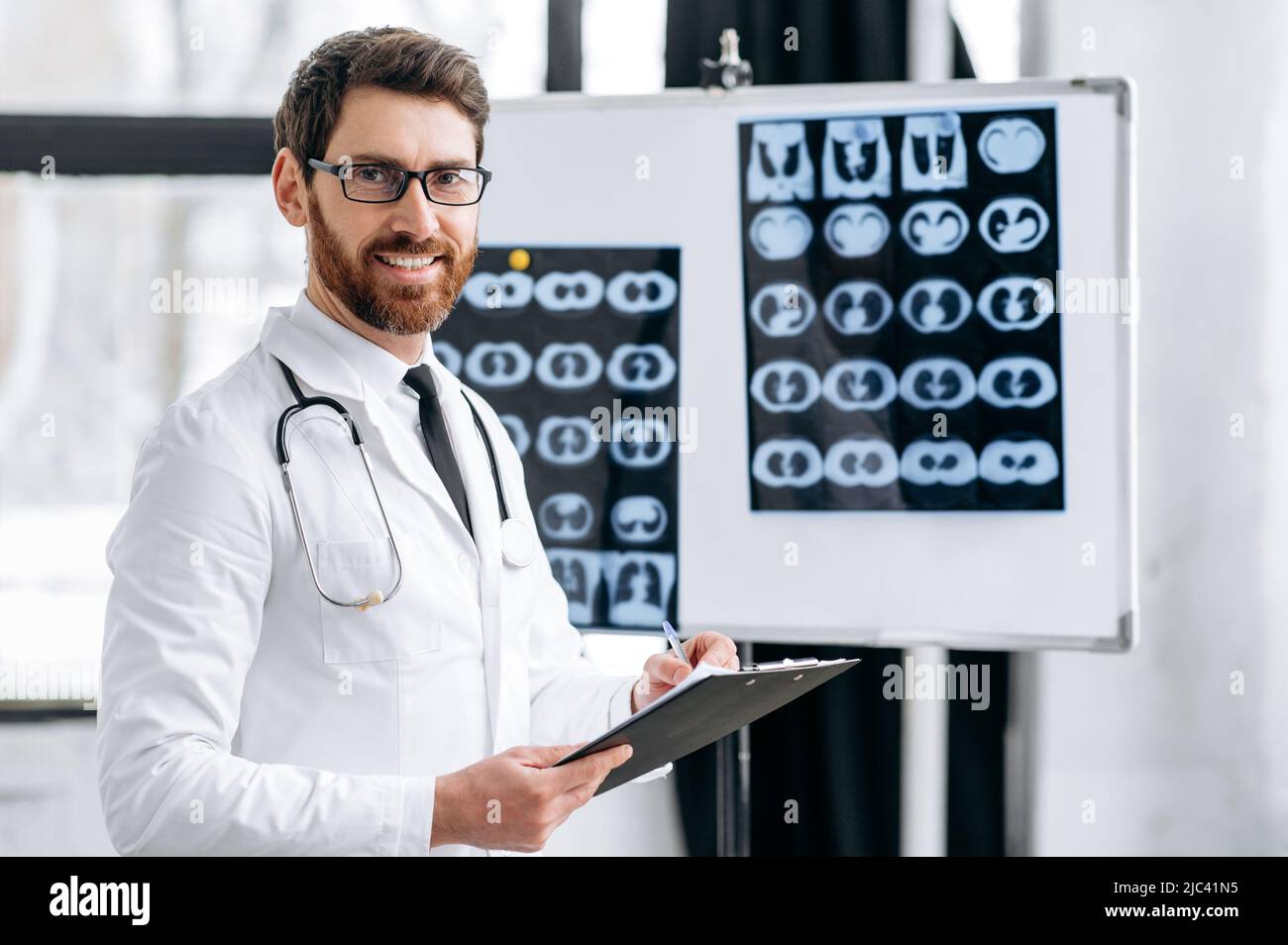 Portrait of proud successful caucasian male general medicine doctor ...