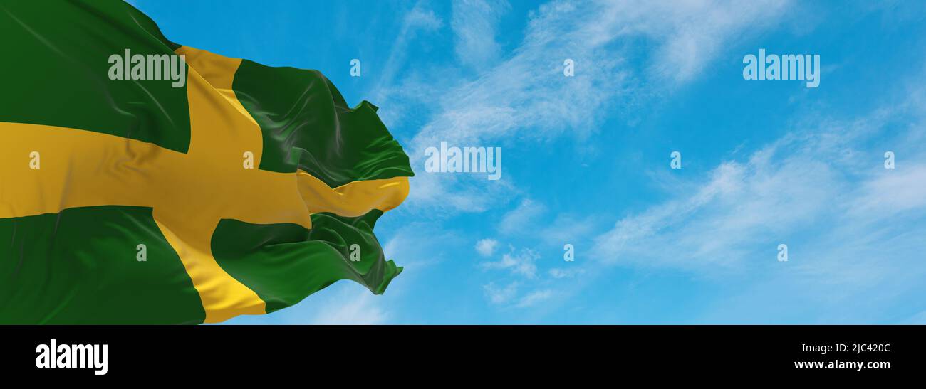official flag of Oland , Sweden at cloudy sky background on sunset ...