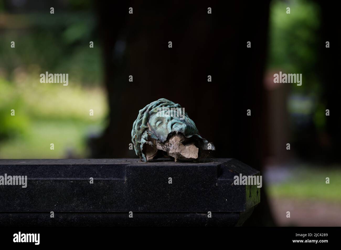 broken head of a crucifix on a tombstone Stock Photo - Alamy