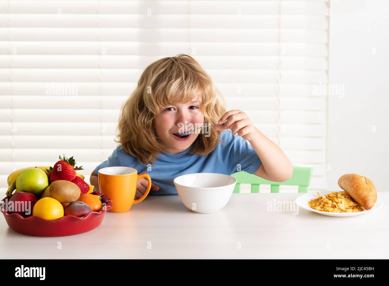 Child boy eating organic healthy food. Healthy vegetables with vitamins ...