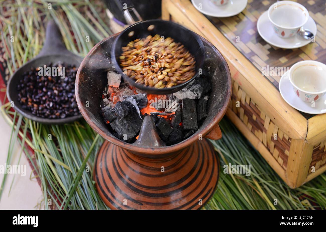 Roasting coffee beans in a traditional Ethiopian coffee ceremony Stock ...
