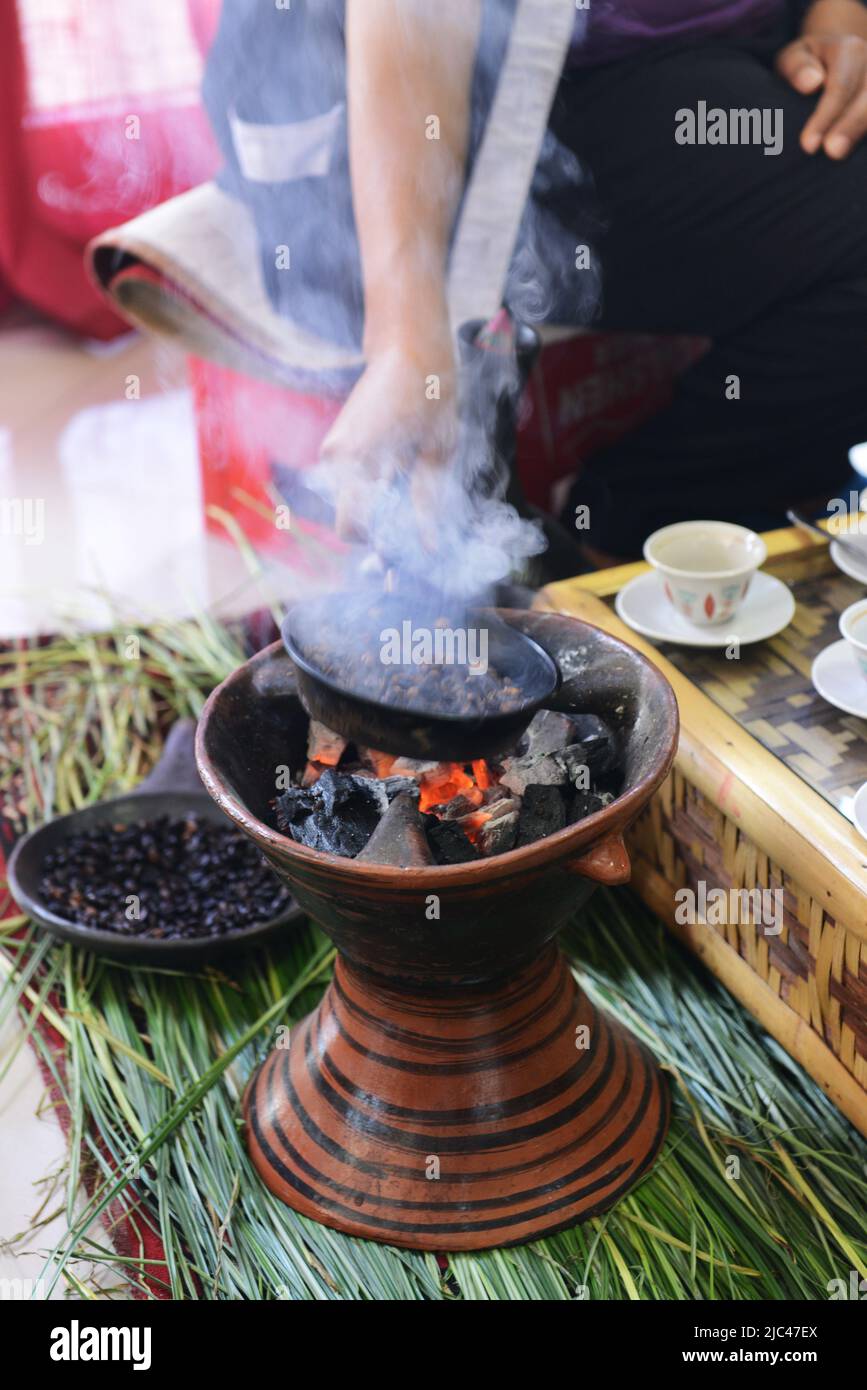 Roasting coffee beans in a traditional Ethiopian coffee ceremony Stock Photo - Alamy