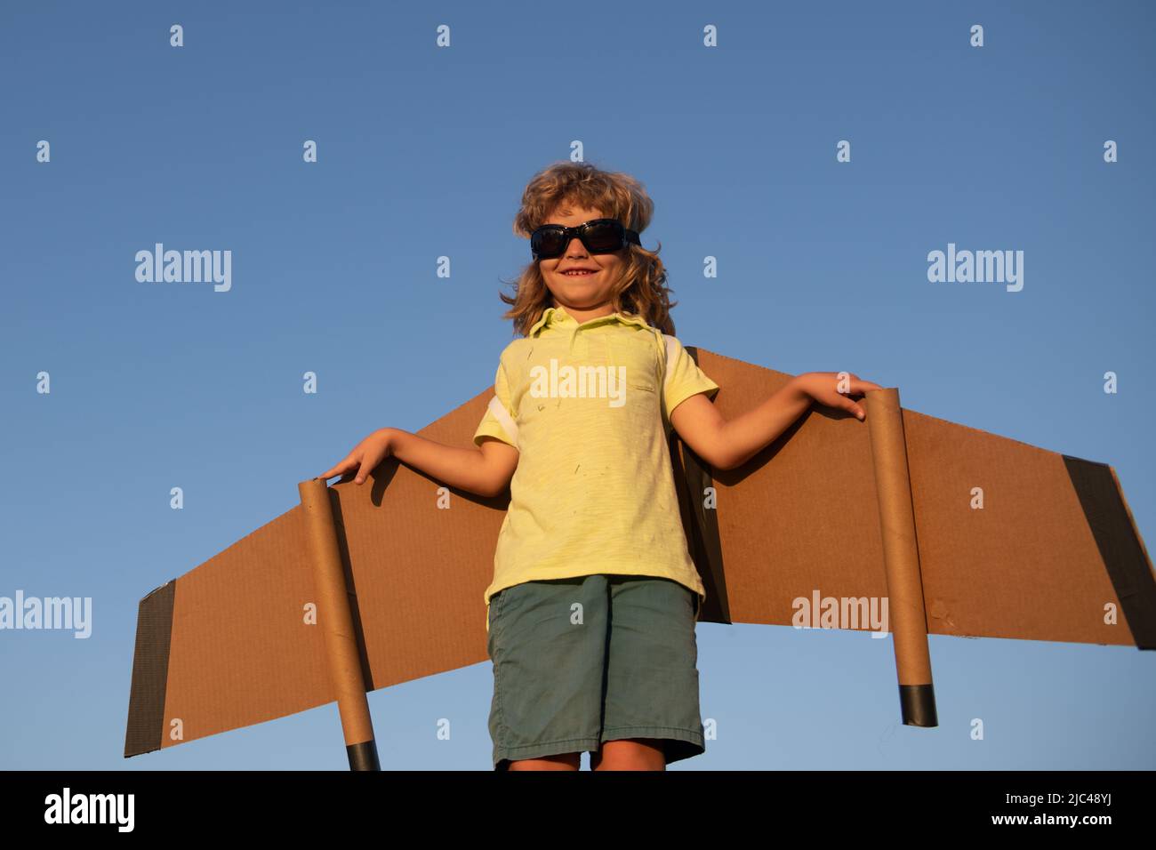 Child playing with toy jetpack. Child pilot astronaut or spaceman ...
