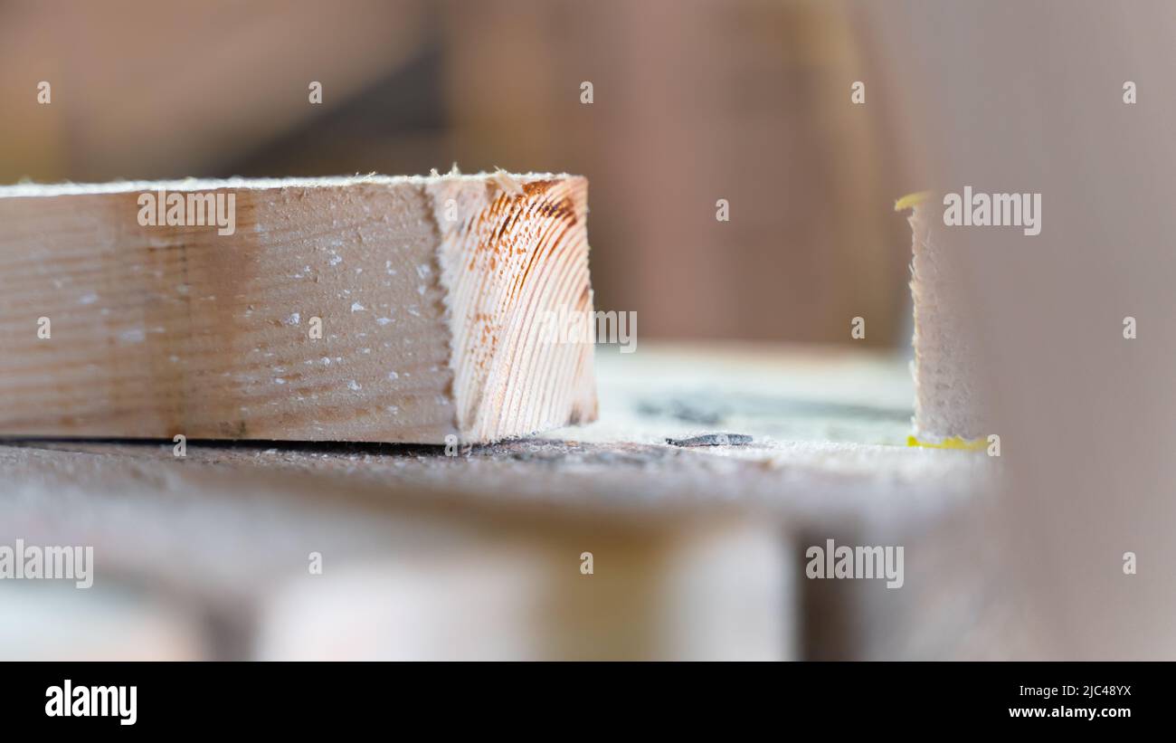 Smooth cut of a wooden beam close-up at a construction site Stock Photo ...