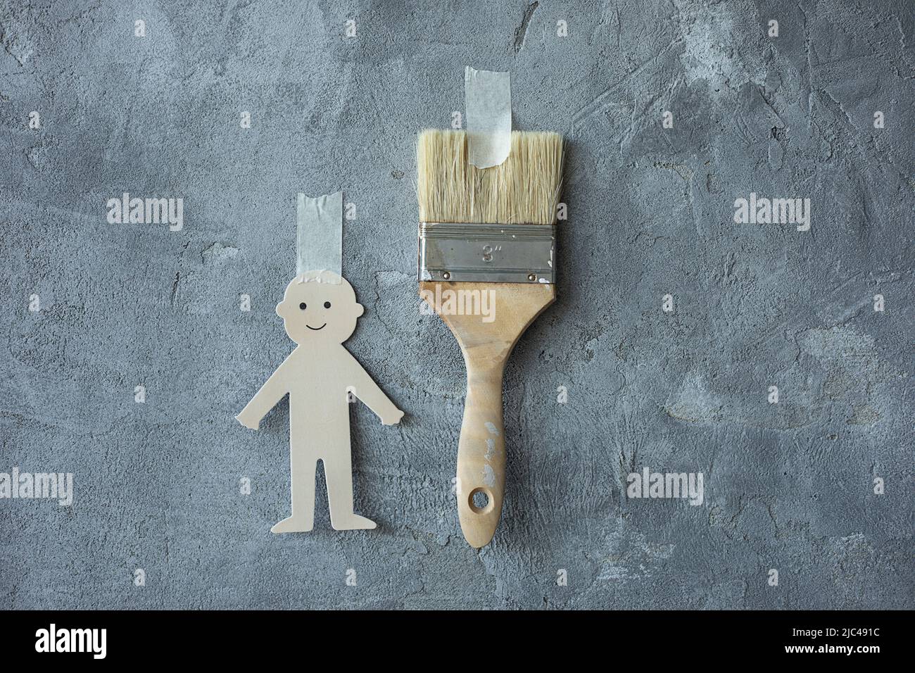 Photo of concept of house repair, paper cut man and wall paint brush ...