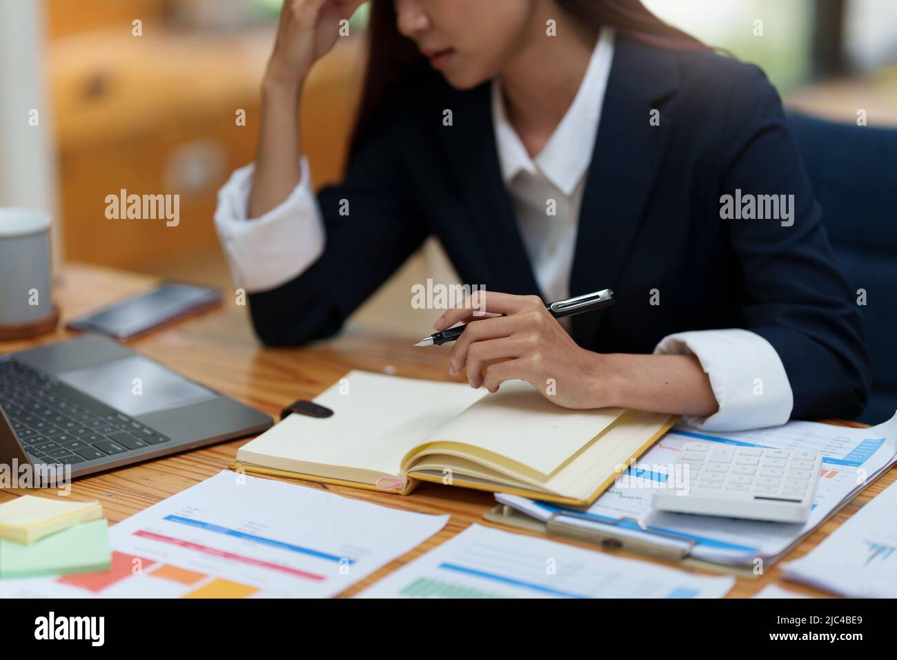 Portrait of Asian business woman worry about marketing plan of this ...
