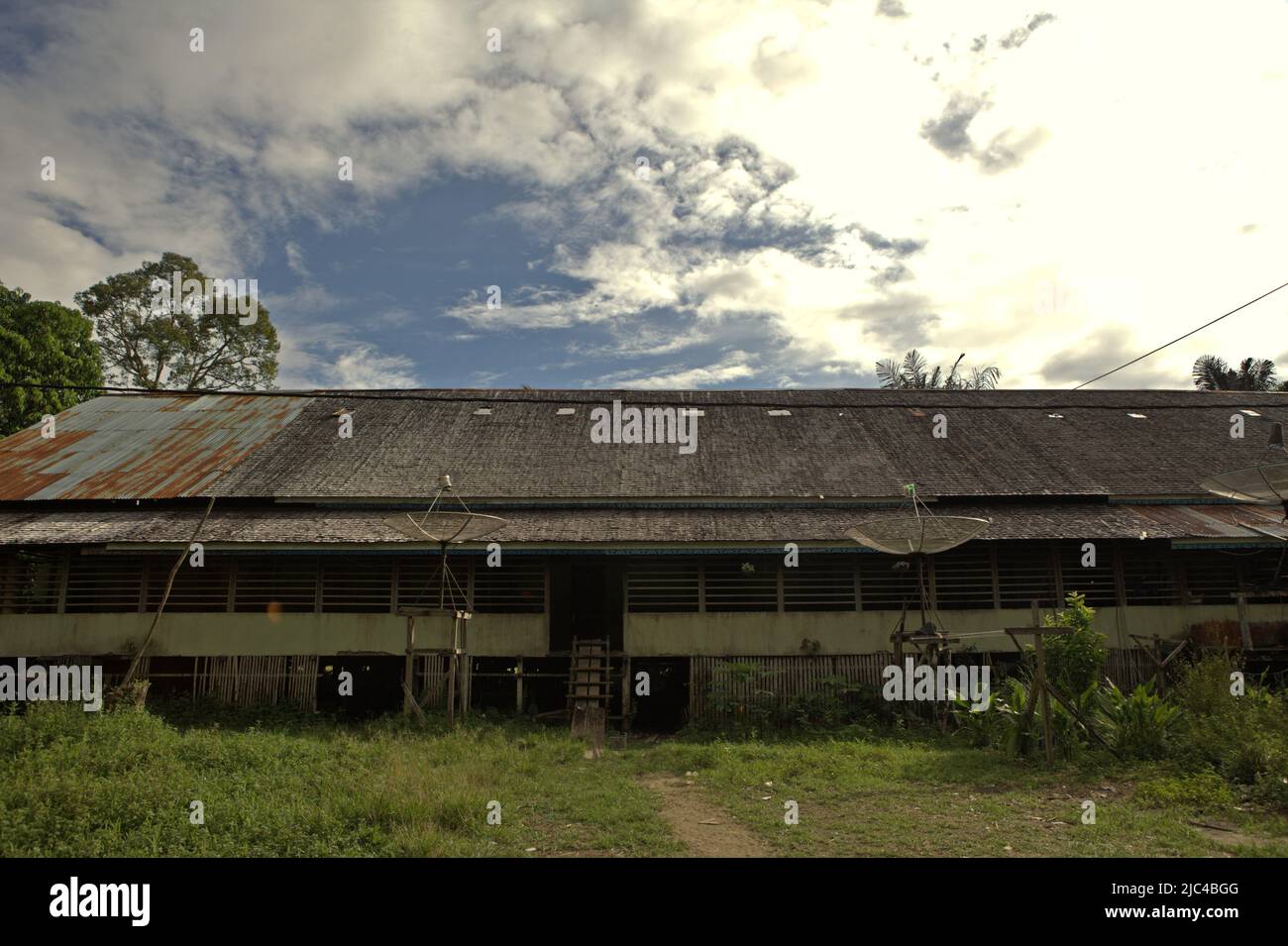 The longhouse of Melapi Patamuan, which is built and inhabited by Dayak ...