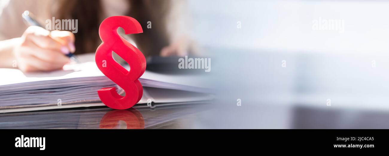 Close-up Of A Red Paragraph Symbol In Front Of Person Working At ...