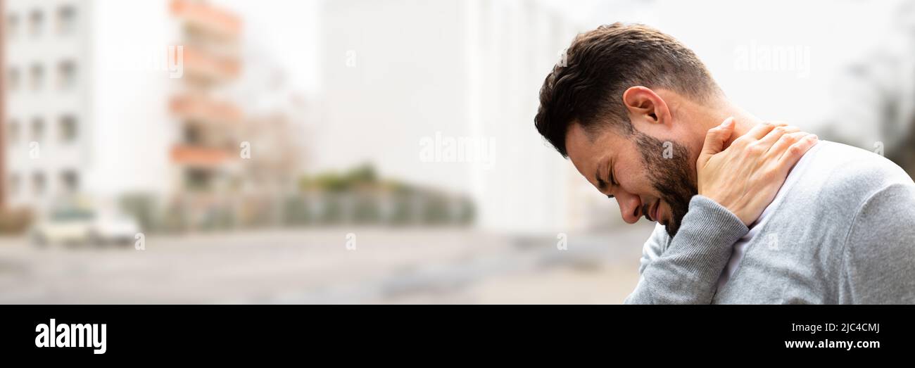 Tired young man neck pain hi-res stock photography and images - Alamy
