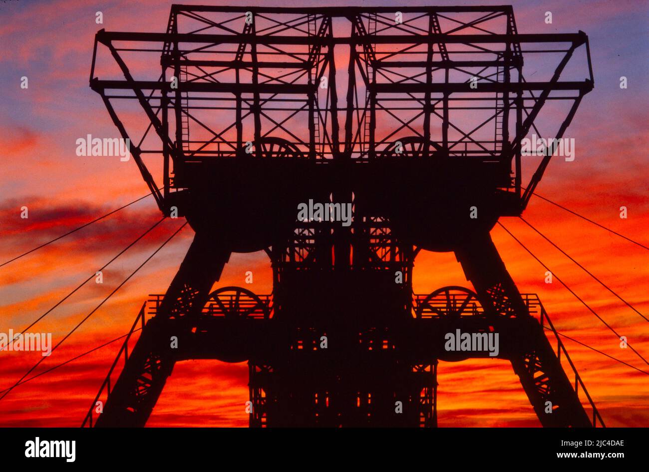 Mining winding tower, winding tower Evening sun, sunset Stock Photo - Alamy