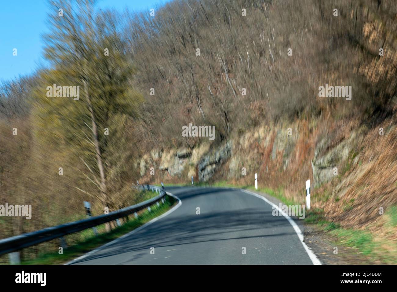 Driving fast at excessive speed on dangerous winding country road ...