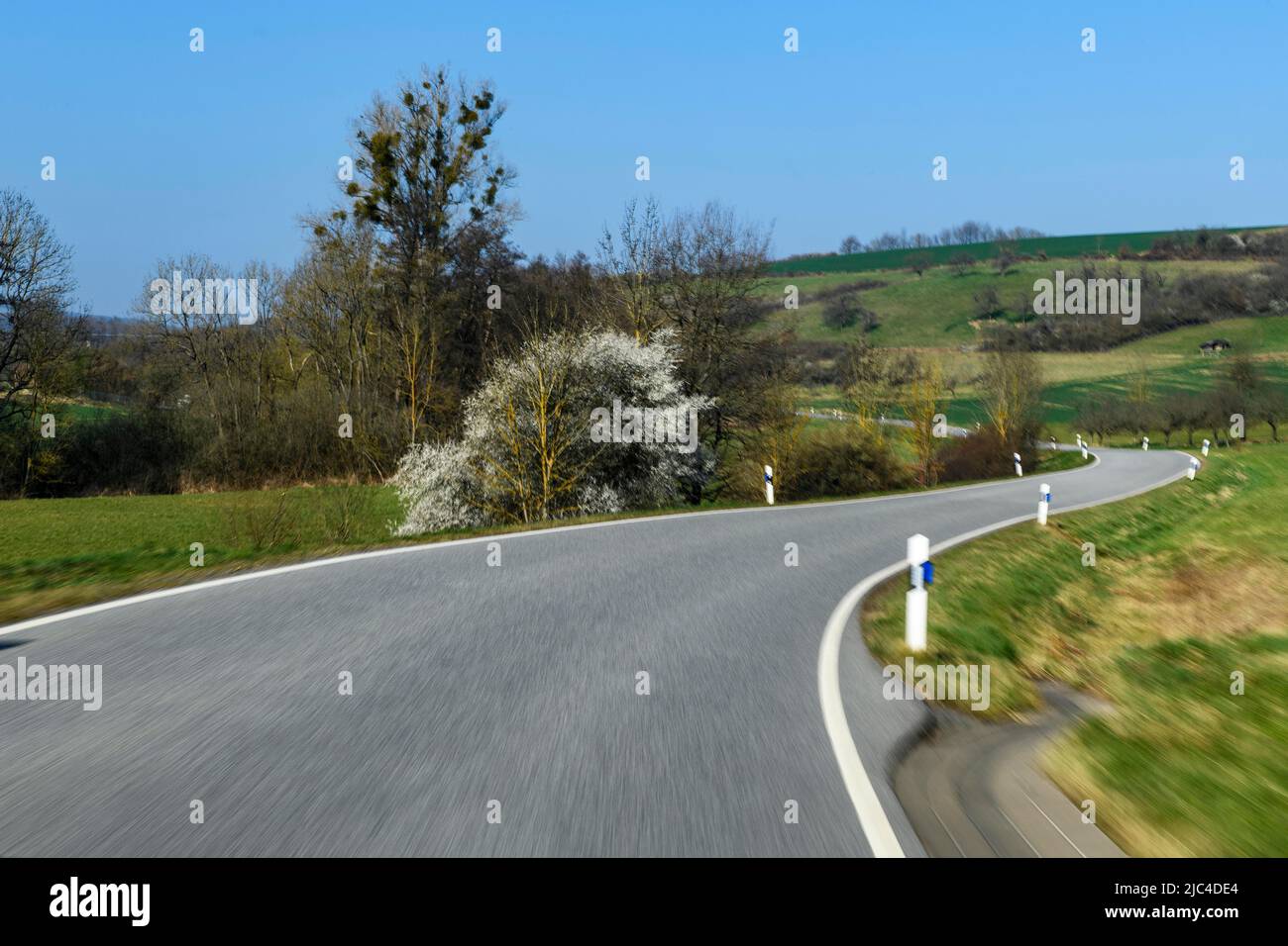 Driving fast at excessive speed on dangerous winding country road ...