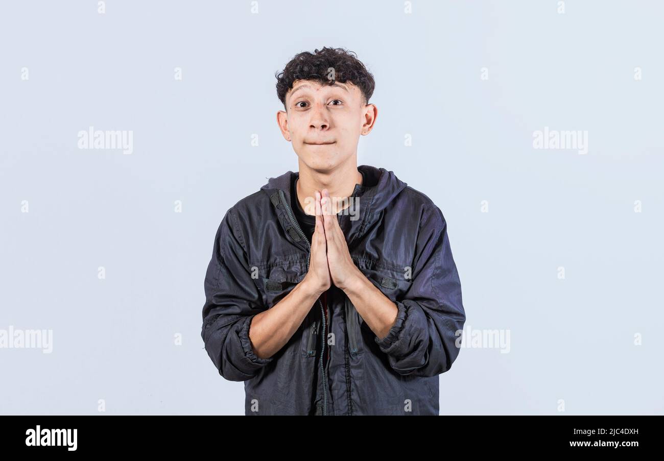 Man asking please, guy putting hands together asking please, worried ...