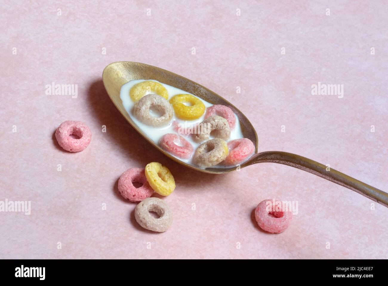 Fruit-flavoured cereal rings in spoon, children's breakfast, cereals ...