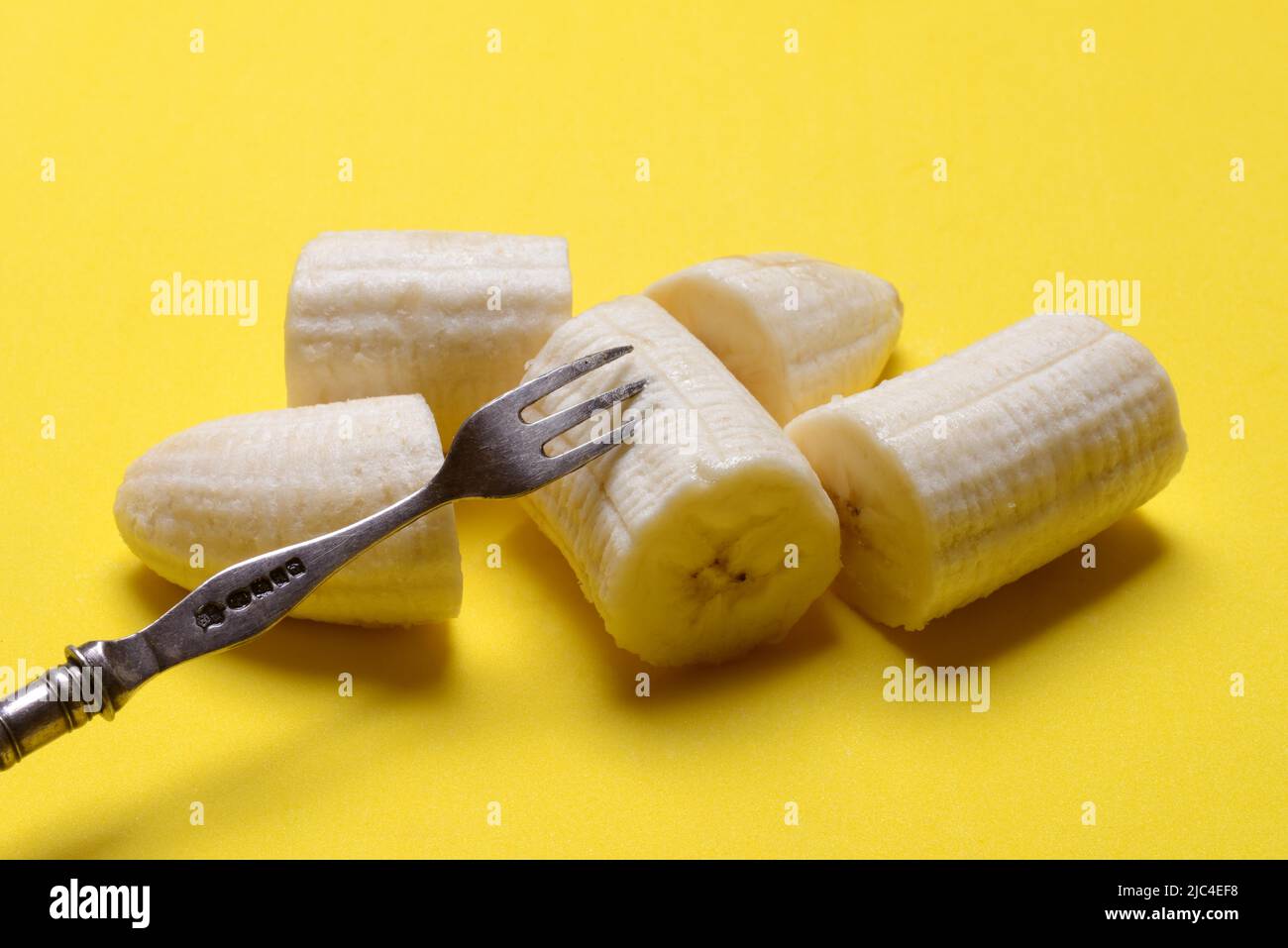 Banana, banana pieces with fork Stock Photo - Alamy