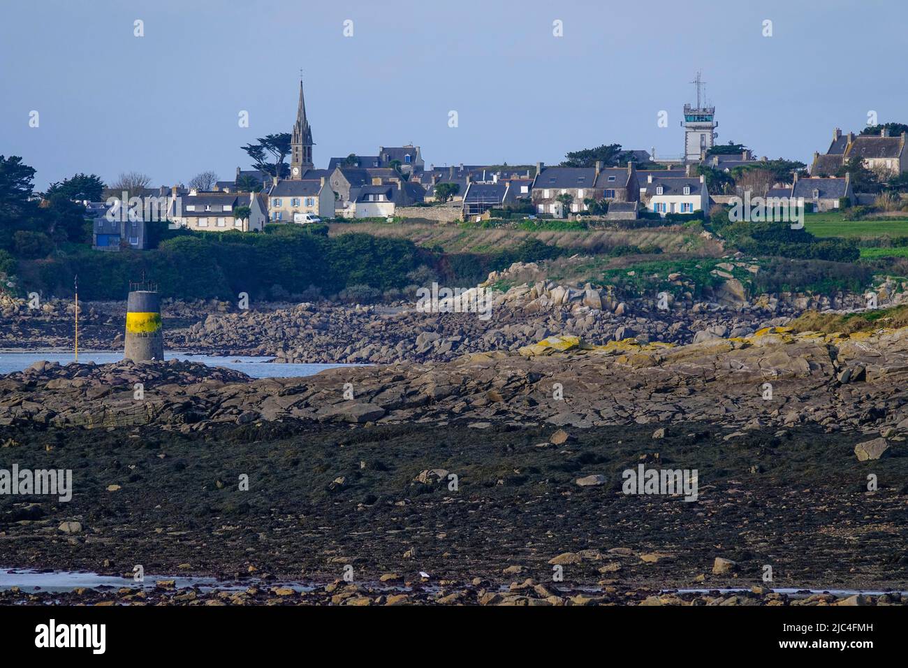 View at low tide from Roscoff to the island Ile de Batz with church ...