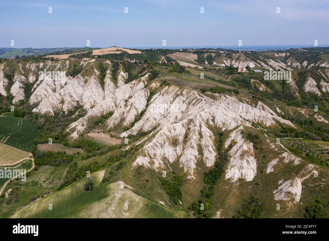 Aerial view of a hilly landscape with erosion valleys, Brisighella ...