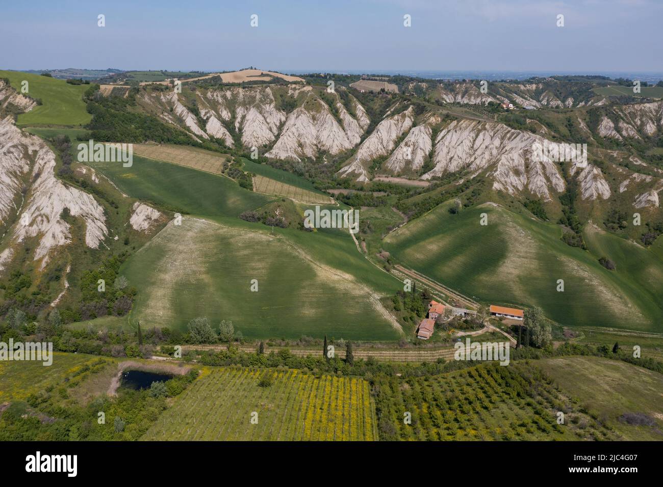Aerial view of a hilly landscape with erosion valleys, Brisighella ...