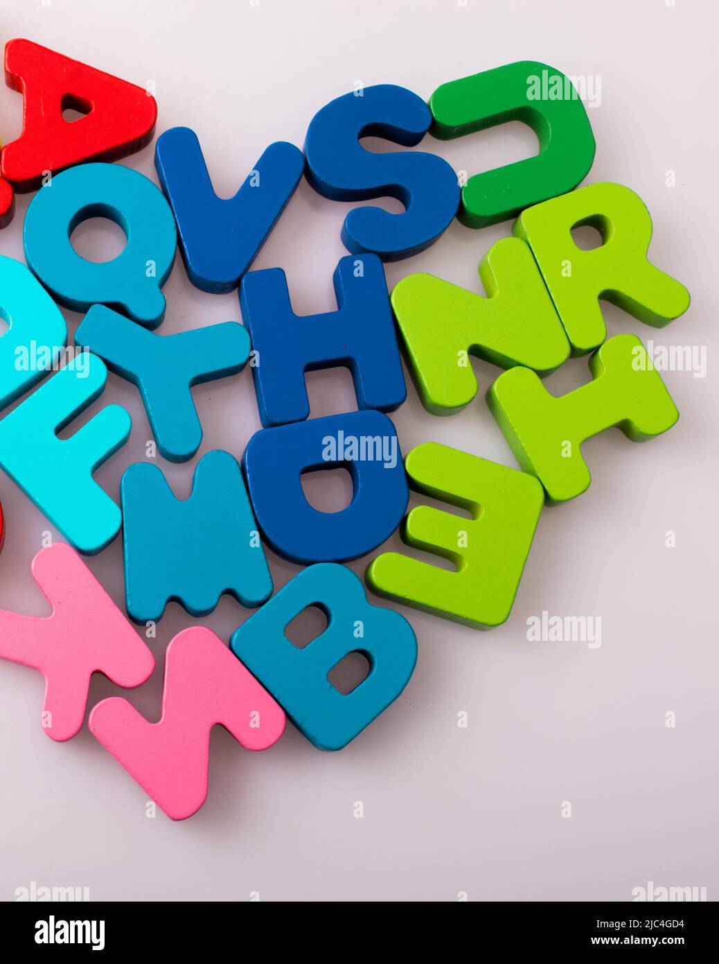 Colorful letter blocks shape heart on white background Stock Photo - Alamy