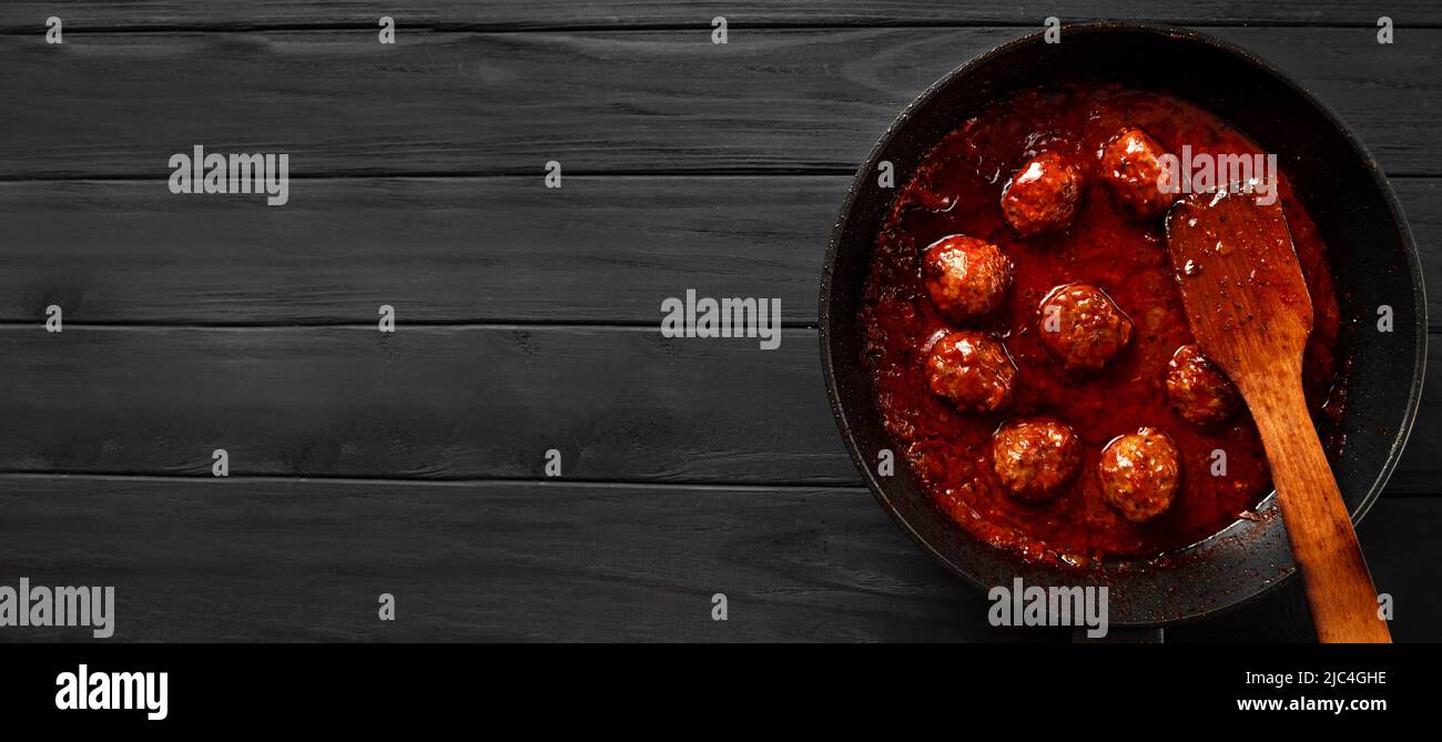 Scandinavian cuisine. Meat balls in sauce in a cast-iron skillet on ...