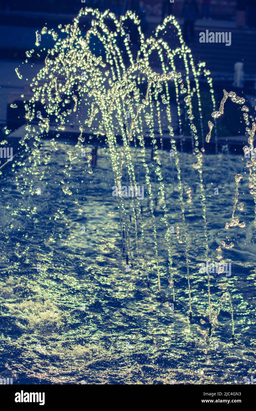 The fountains gushing sparkling water in a pool in a park Stock Photo ...