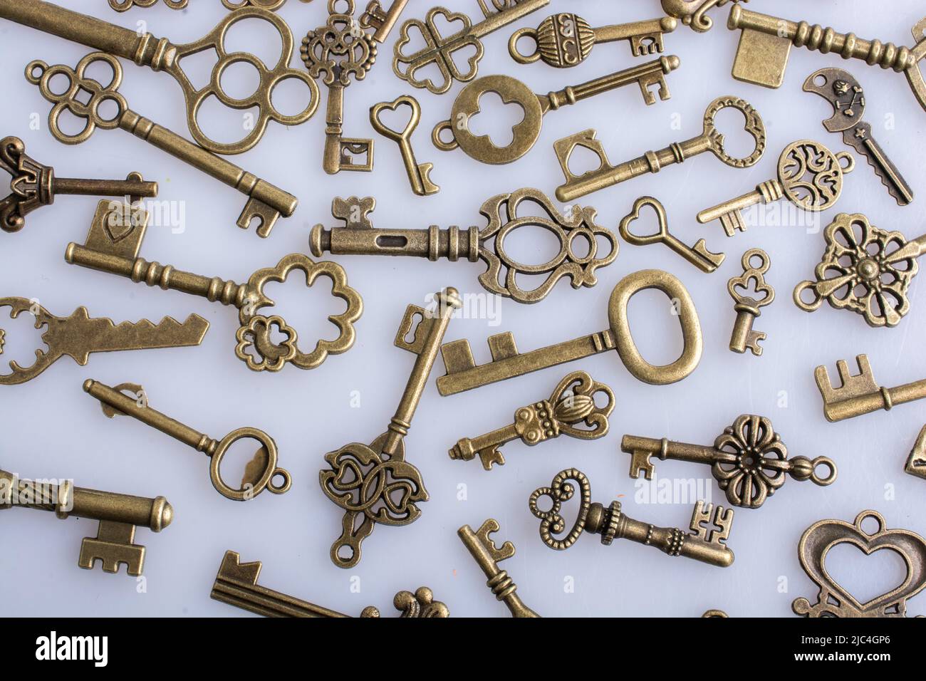 Retro style metal keys on a white background Stock Photo - Alamy