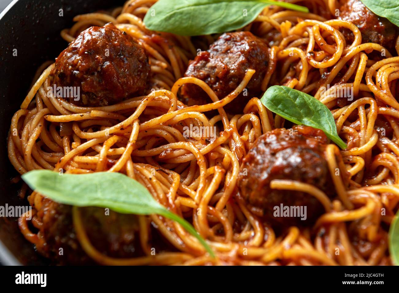 The process of making Italian pasta with meat balls. A plate of ...